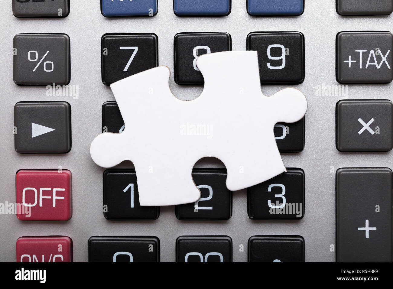 Blank Jigsaw Puzzle Piece On Calculator Stock Photo - Alamy