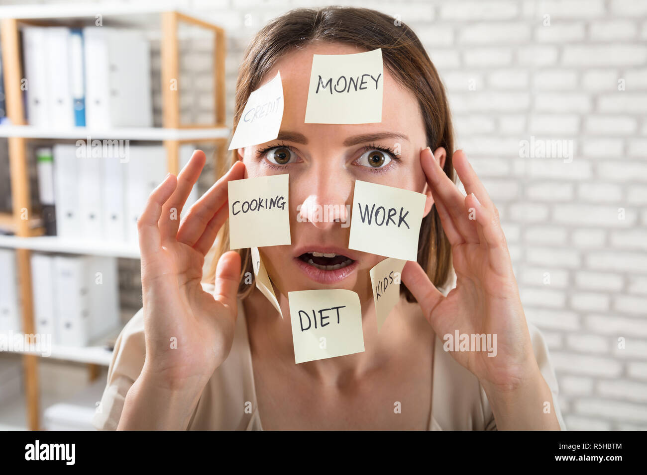 Woman With Sticky Notes On Her Face Stock Photo - Alamy