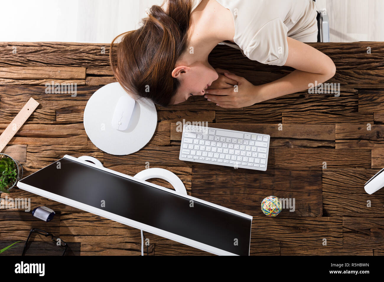Office workers sleeping at desk hi-res stock photography and images - Alamy