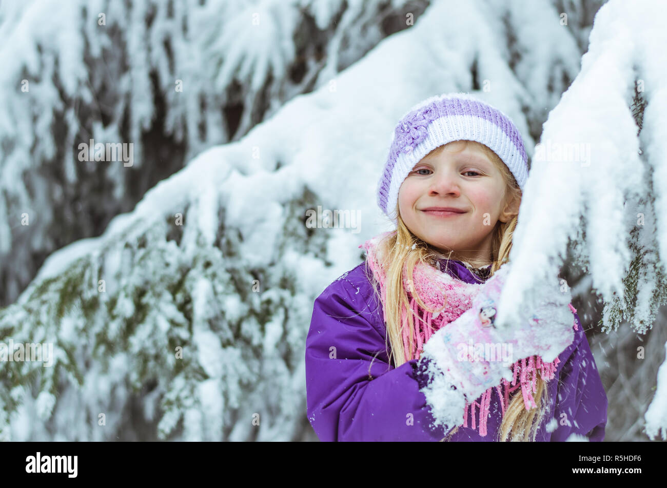 little girl in winter time having fun in snow Stock Photo - Alamy