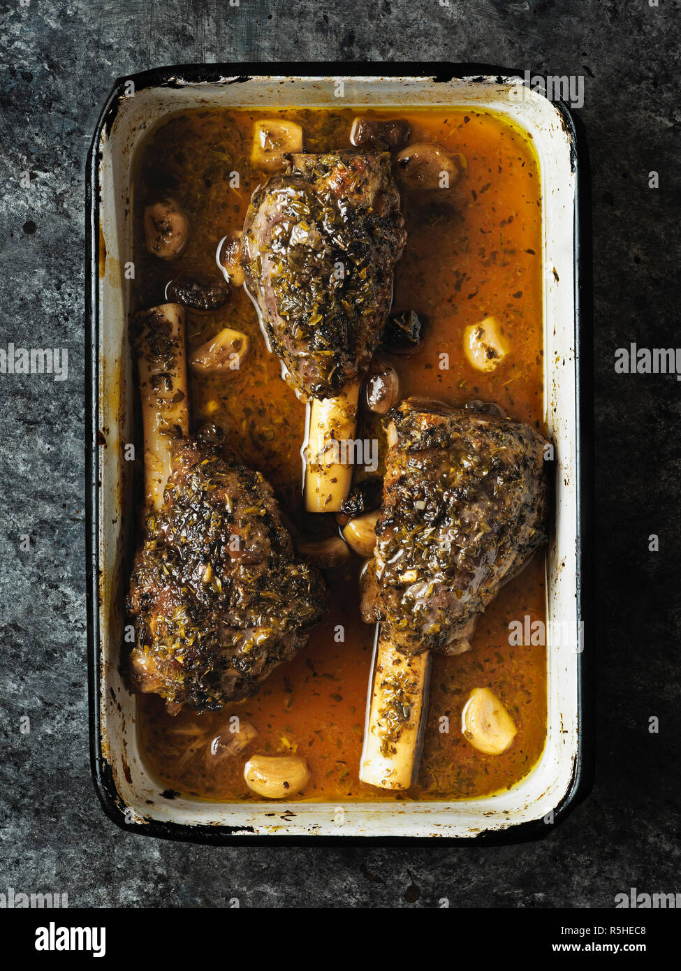 rustic greek roasted lamb shank Stock Photo - Alamy