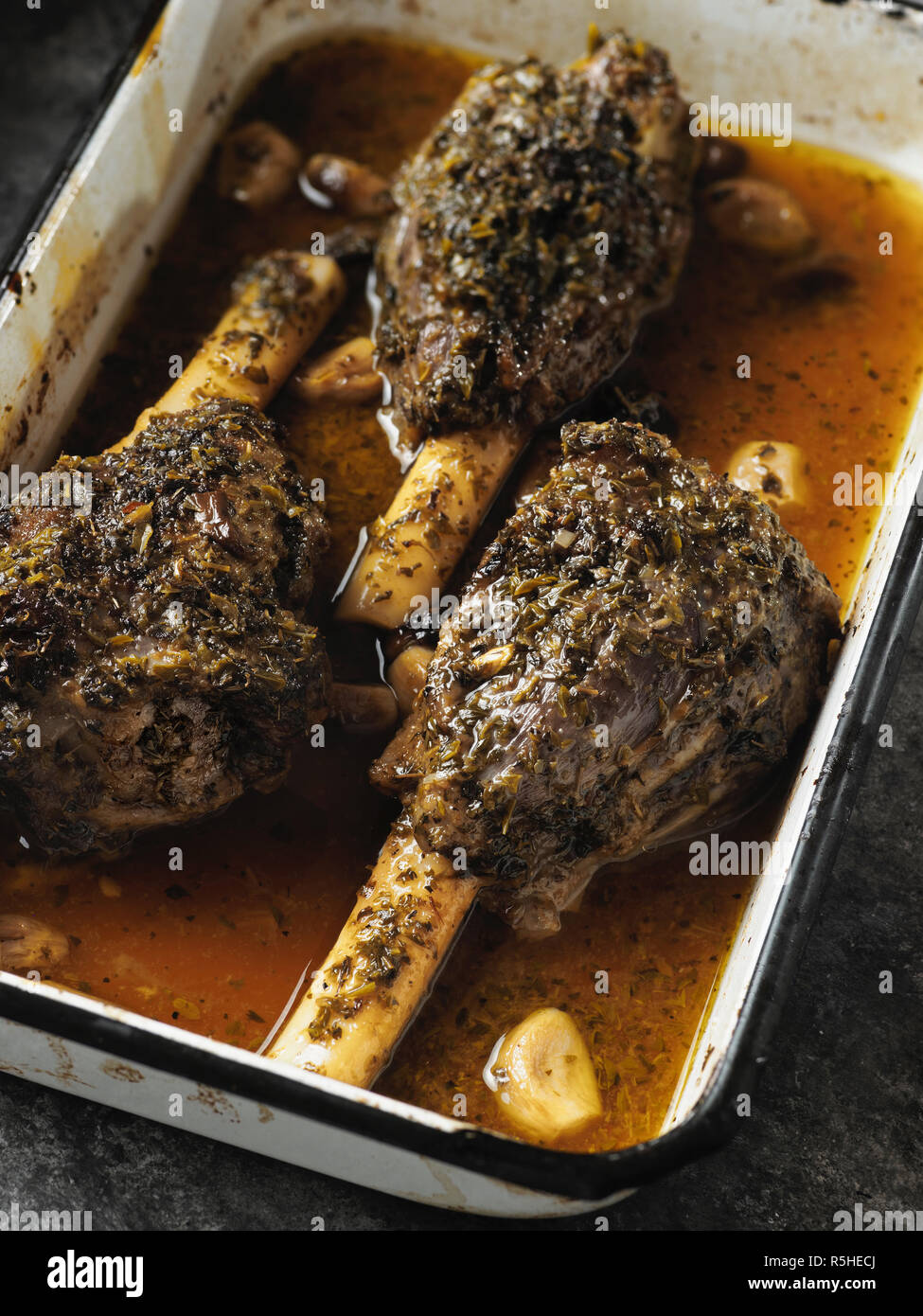 rustic greek roasted lamb shank Stock Photo - Alamy