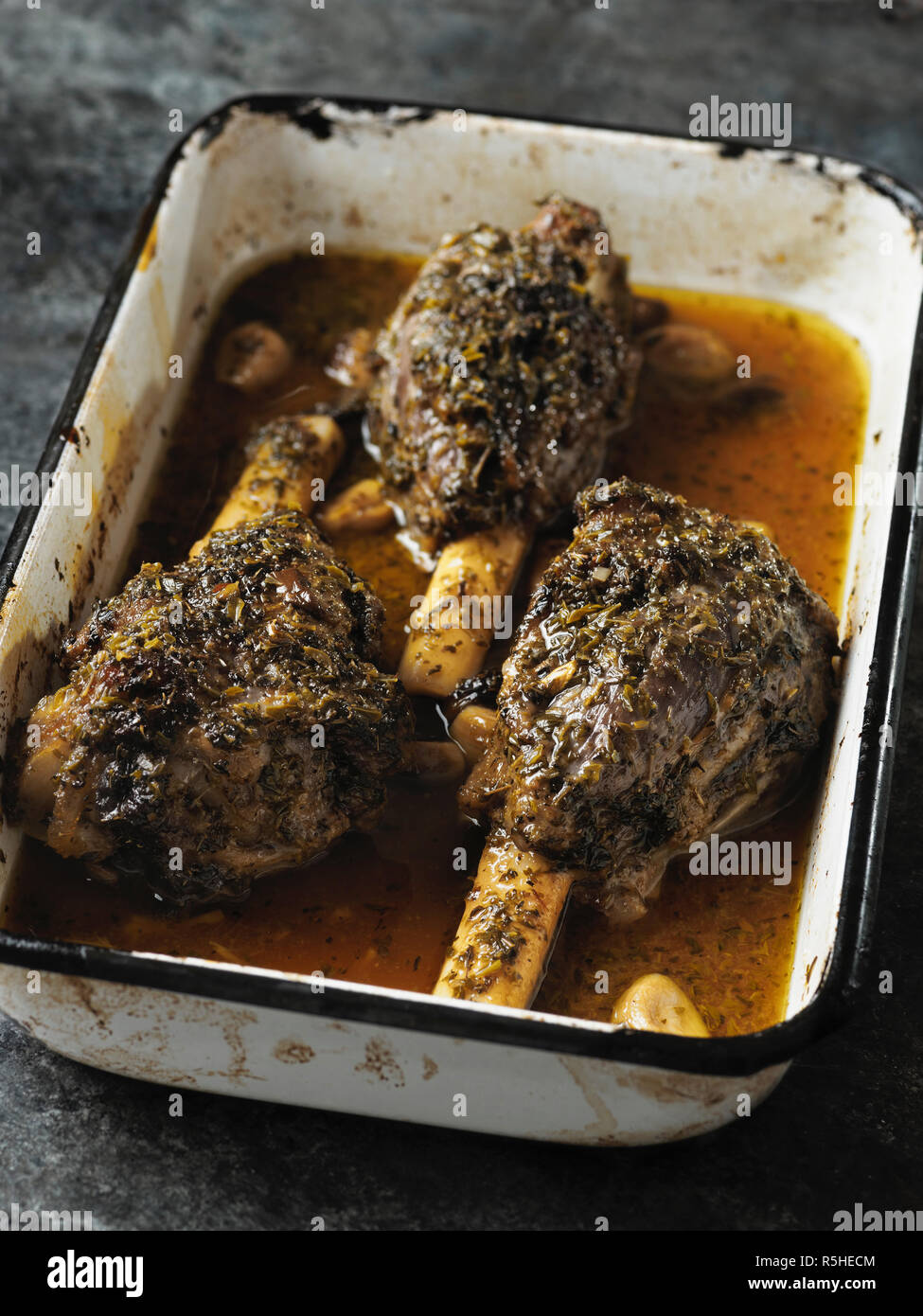 rustic greek roasted lamb shank Stock Photo - Alamy