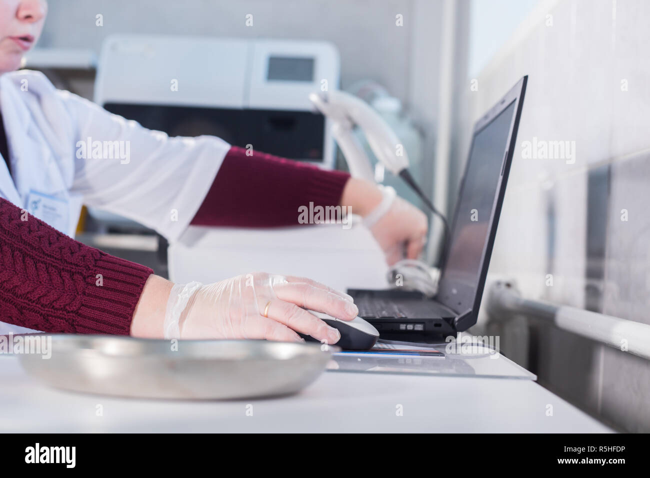 Medical clinic. Nurse works with blood. Working with a laptop Stock ...