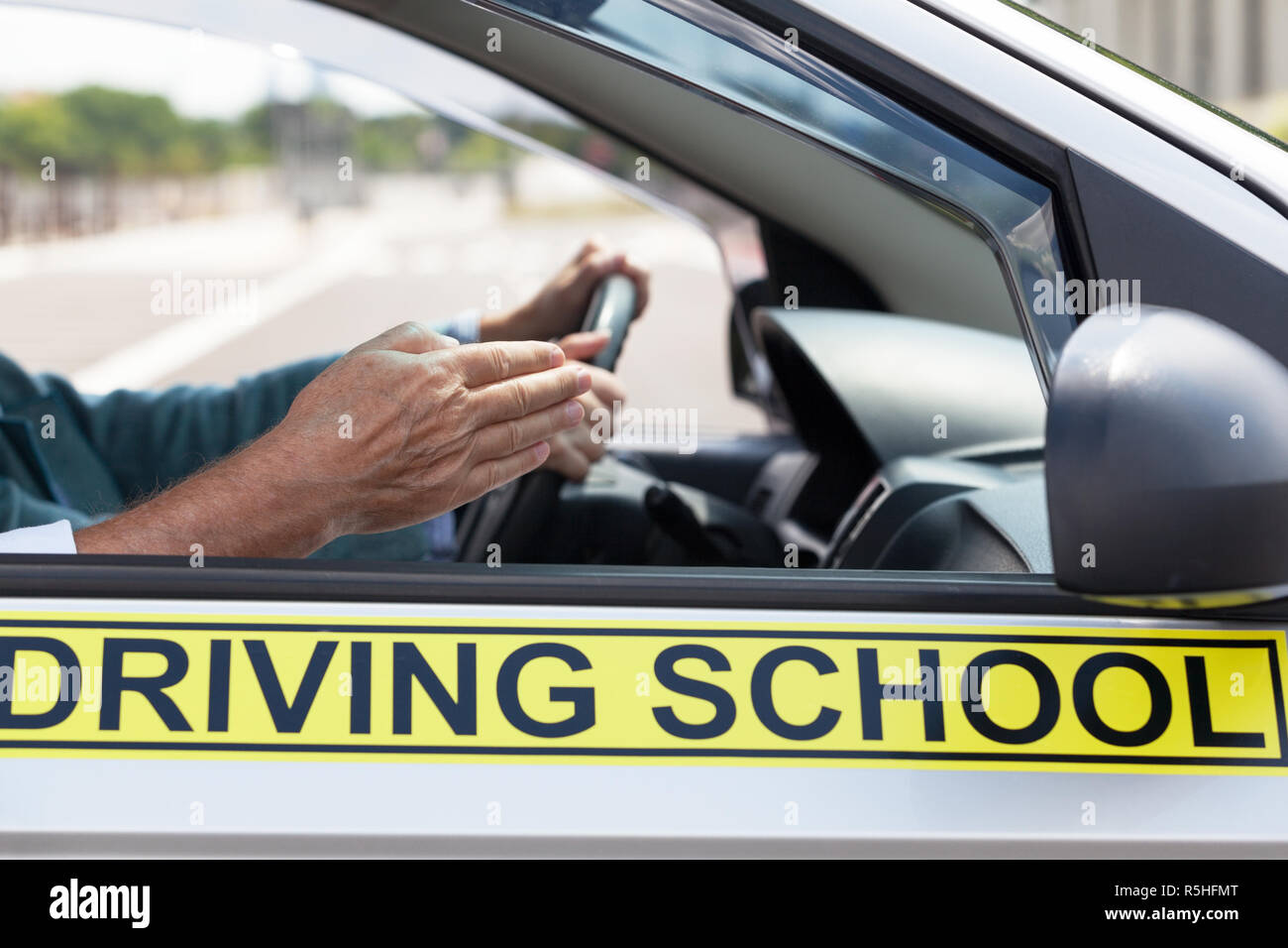 Learner driver student driving car with instructor Stock Photo - Alamy