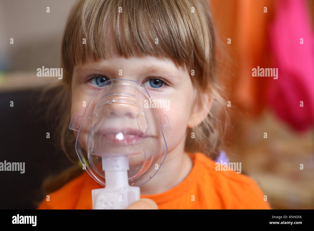 Happy child makes inhalation at home for Stock Photo - Alamy