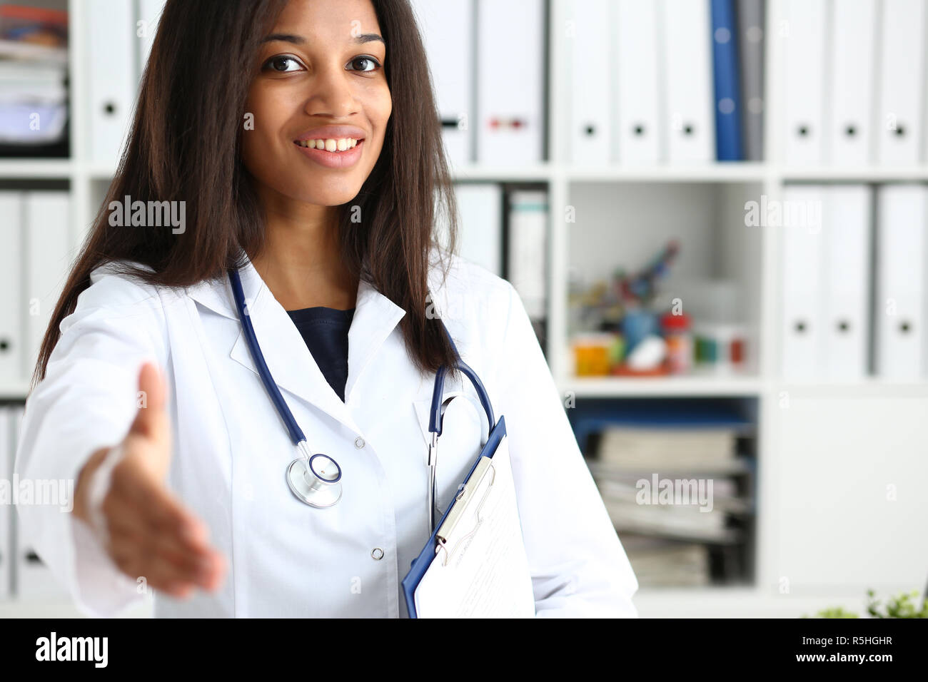 Doctor shake hand as hello with patient Stock Photo - Alamy
