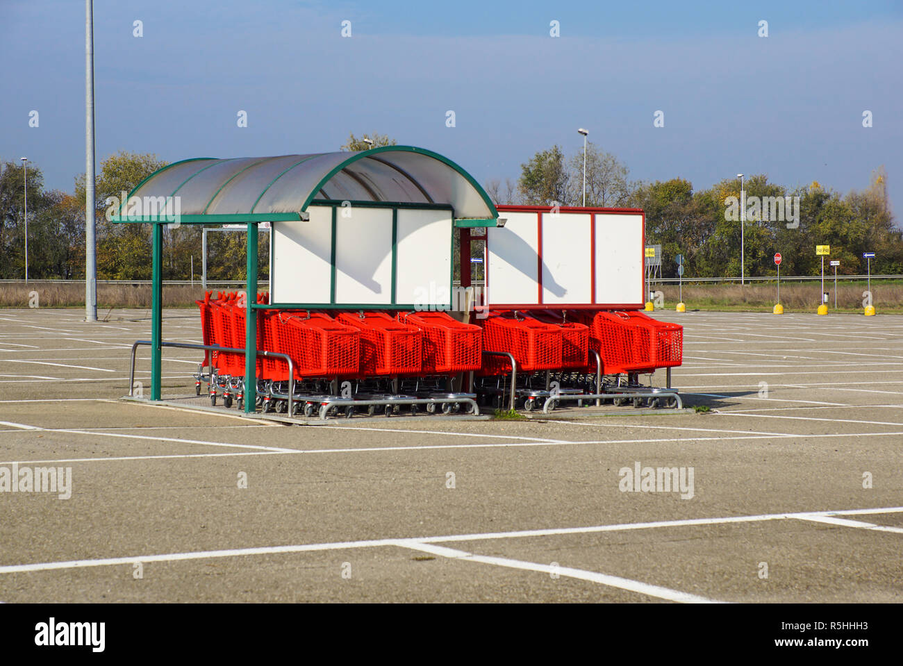 wheel of shopping carts on a parking lot. detail of a shopping cart ...