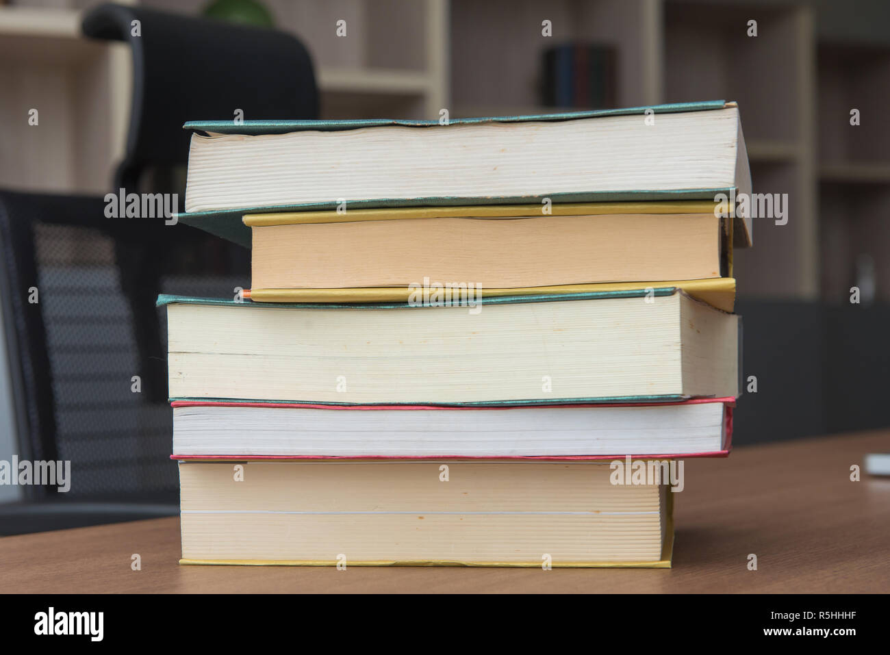 Pack of Book stack on table in working room at office, Vintage style ...