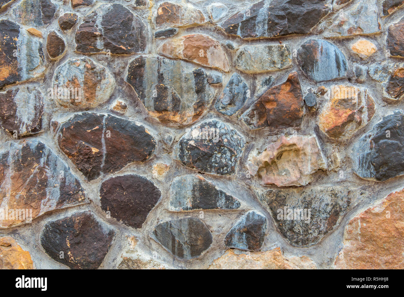 Background of stone wall texture abstract for design Stock Photo - Alamy