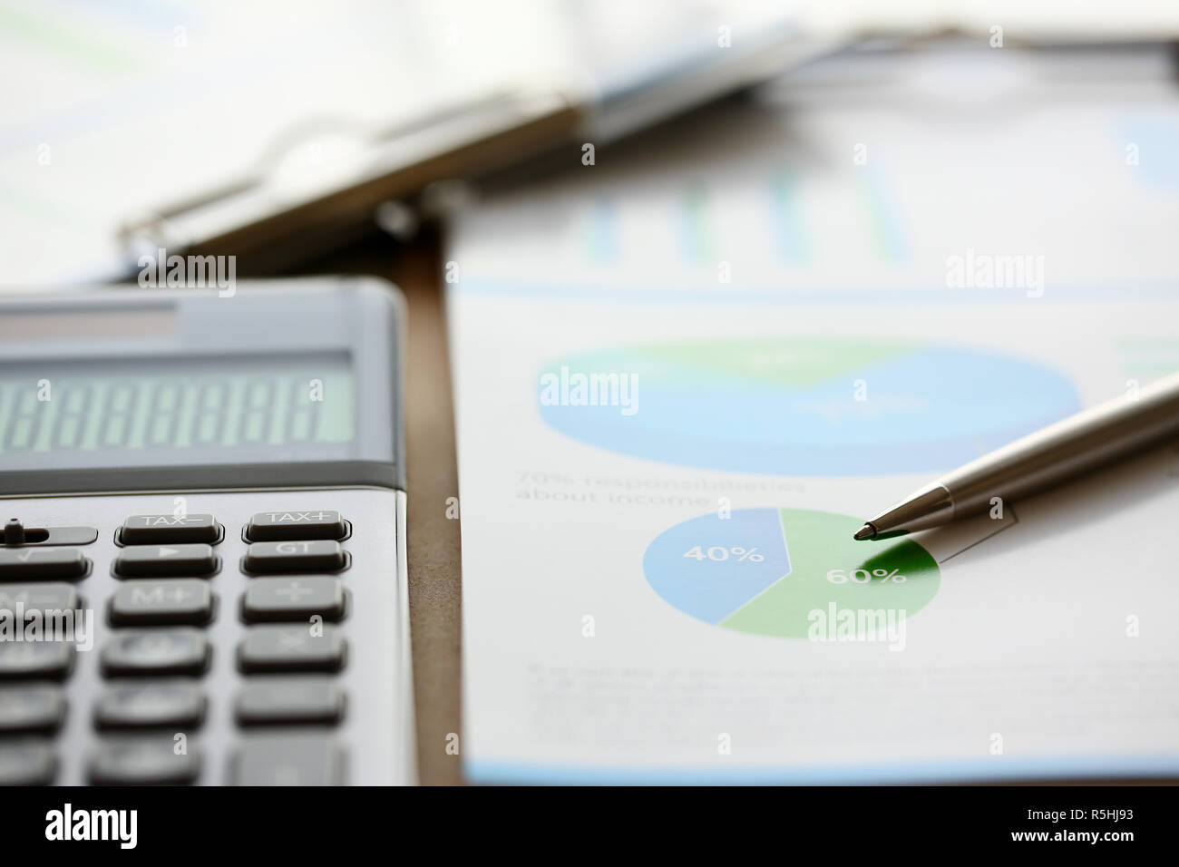 Silver calculator with gray keyboard is lying Stock Photo - Alamy