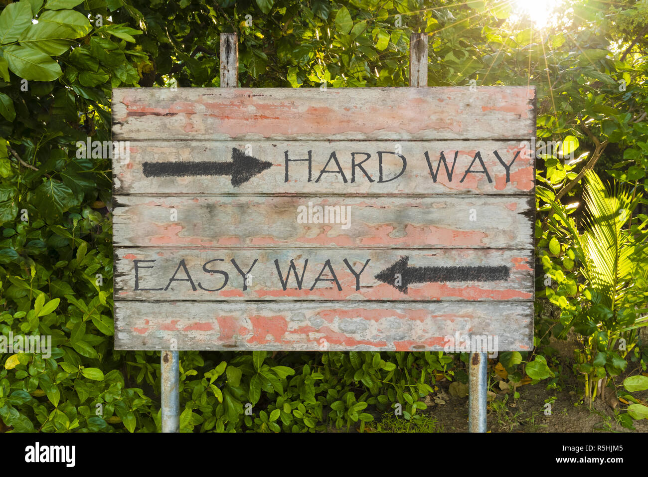 Easy Way versus Hard Way with directional arrows on old vintage board ...