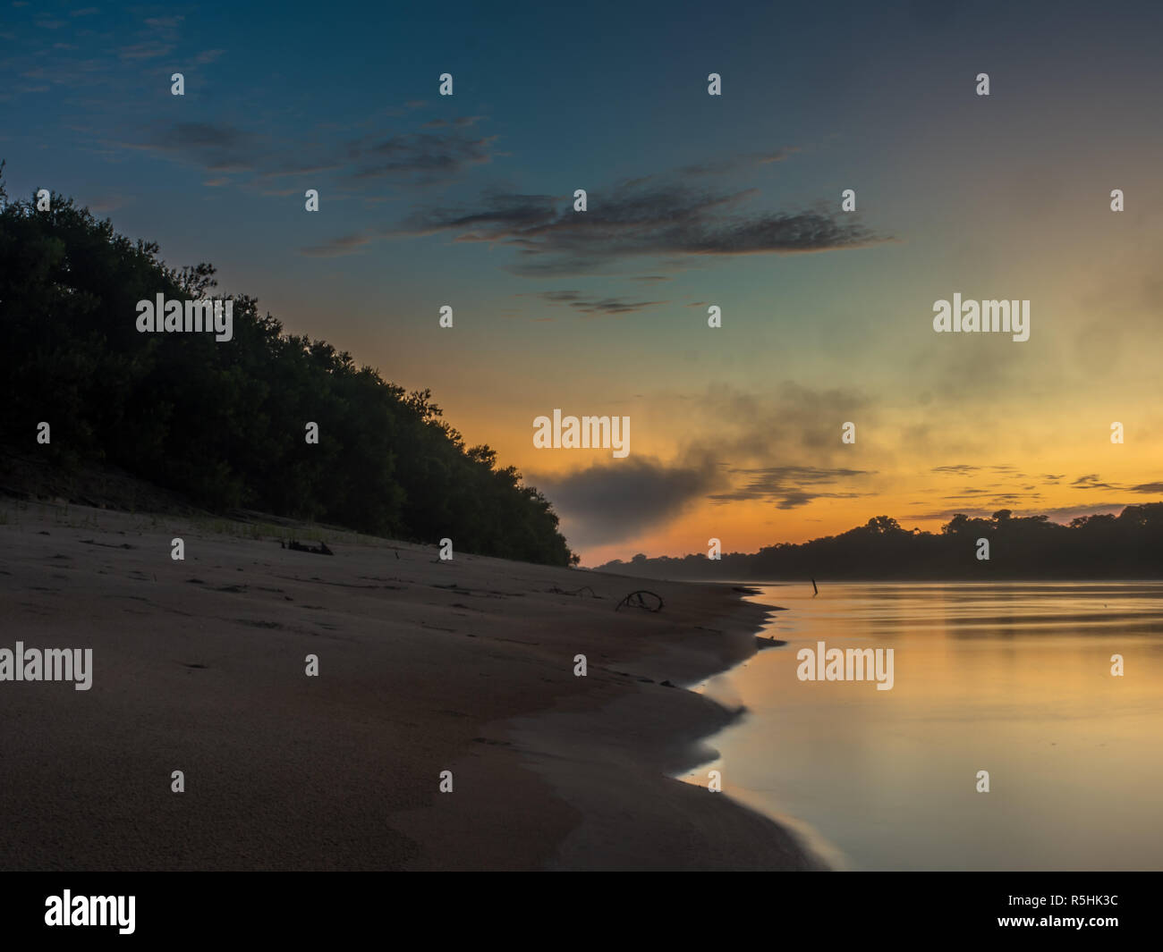 Sunrise over the Javarii river, tributary of the Amazon. Sandy beach in ...