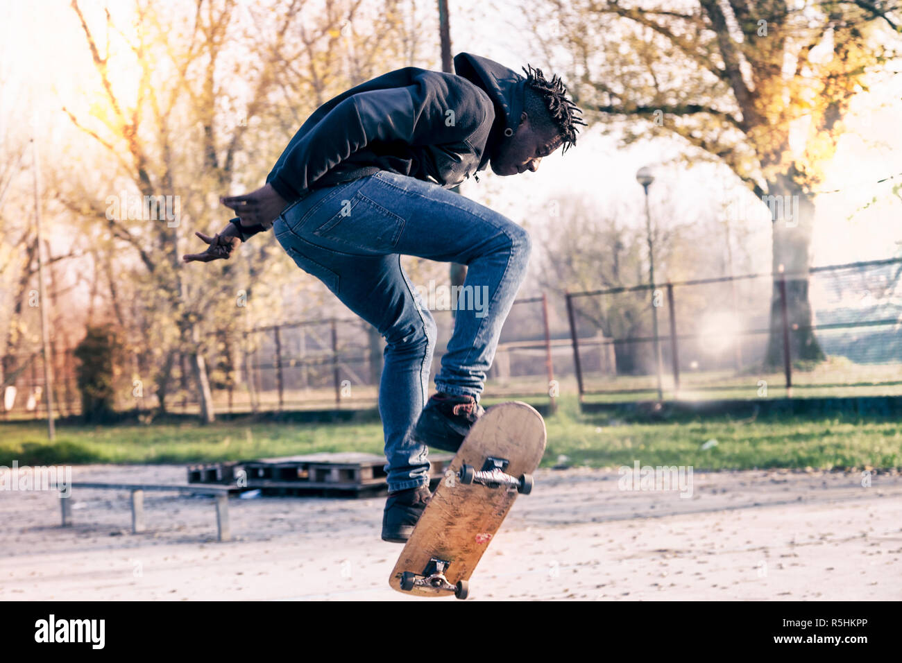 young skateboarder jumping on a ramp outdoor Stock Photo - Alamy