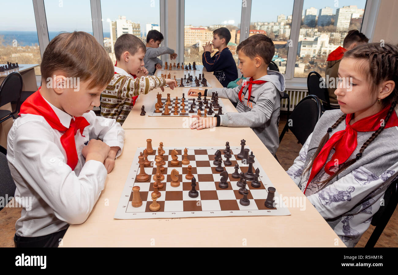 Russia, Vladivostok, 12/01/2018. Kids play chess during chess ...