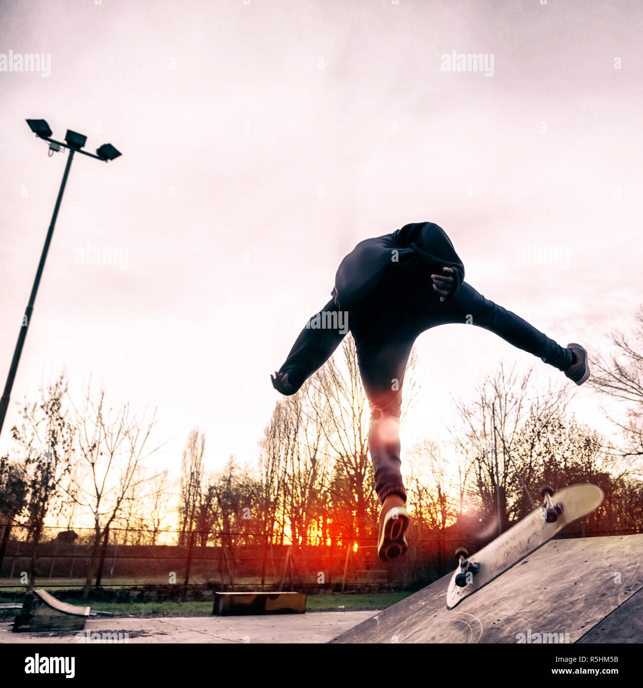 young skateboarder jumping on a ramp outdoor Stock Photo - Alamy