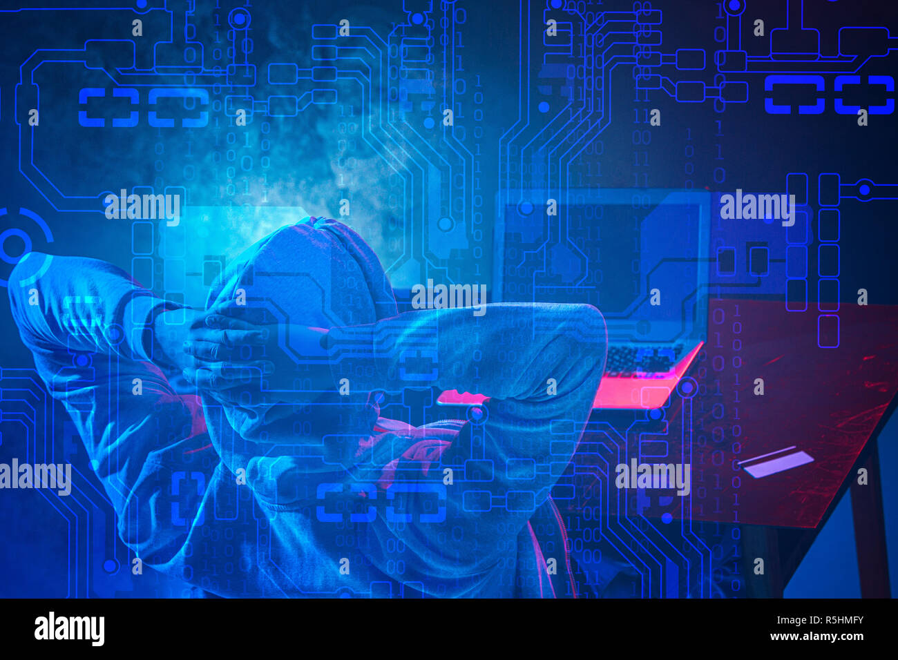 Hooded computer hacker stealing information with laptop Stock Photo - Alamy