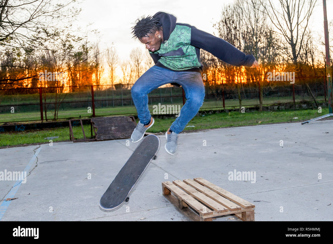 young skateboarder jumping on a ramp outdoor Stock Photo - Alamy