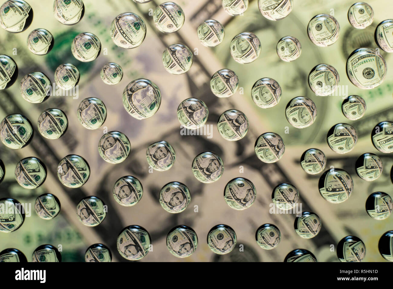 Image of dollar bills in water drops on a blurred background of ...