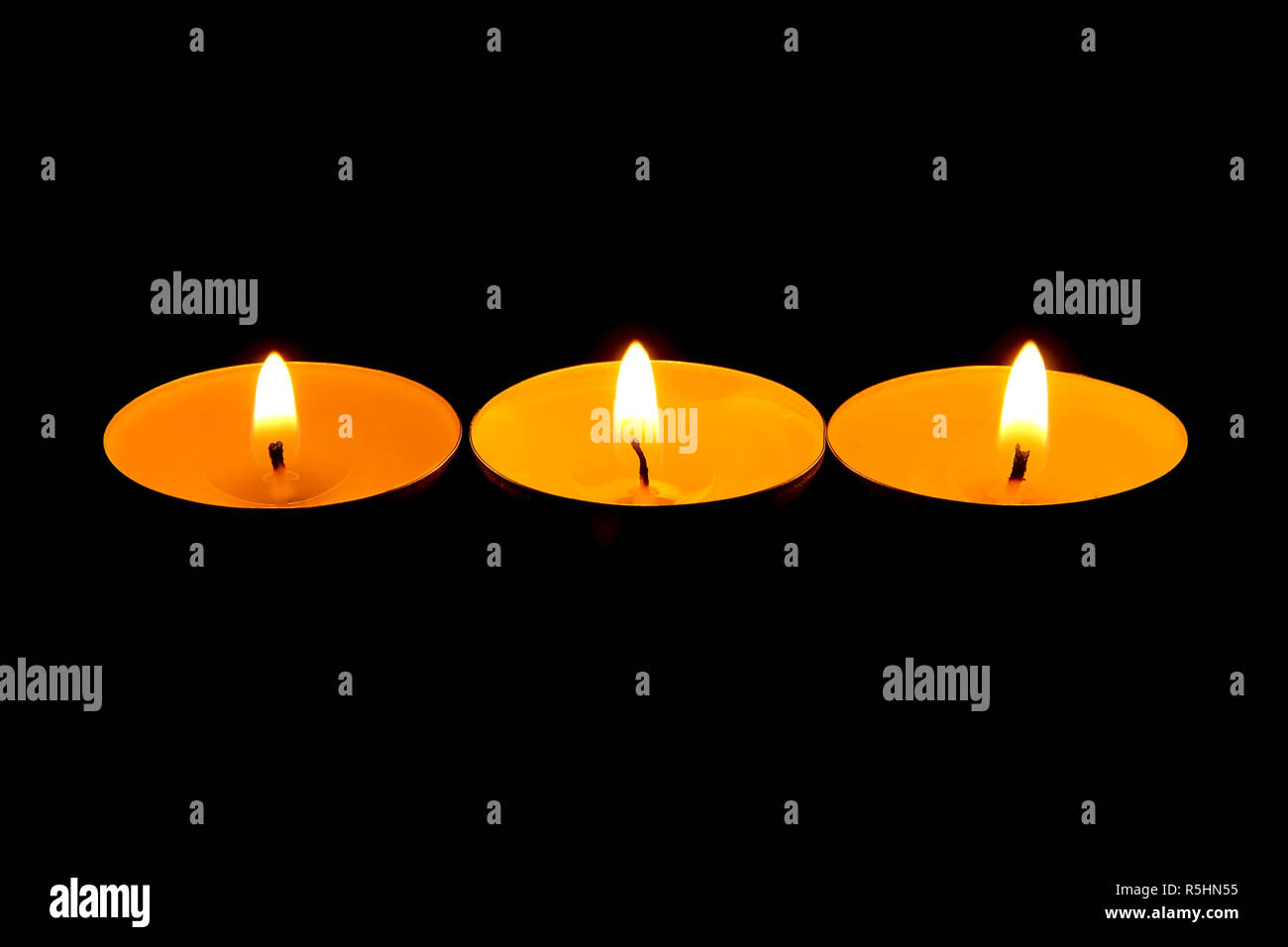 Three burning candles hi-res stock photography and images - Alamy