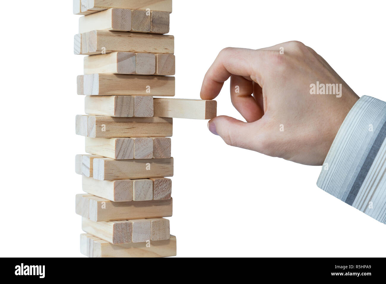 Businessman's hand taking first block or putting last block to sturdy ...