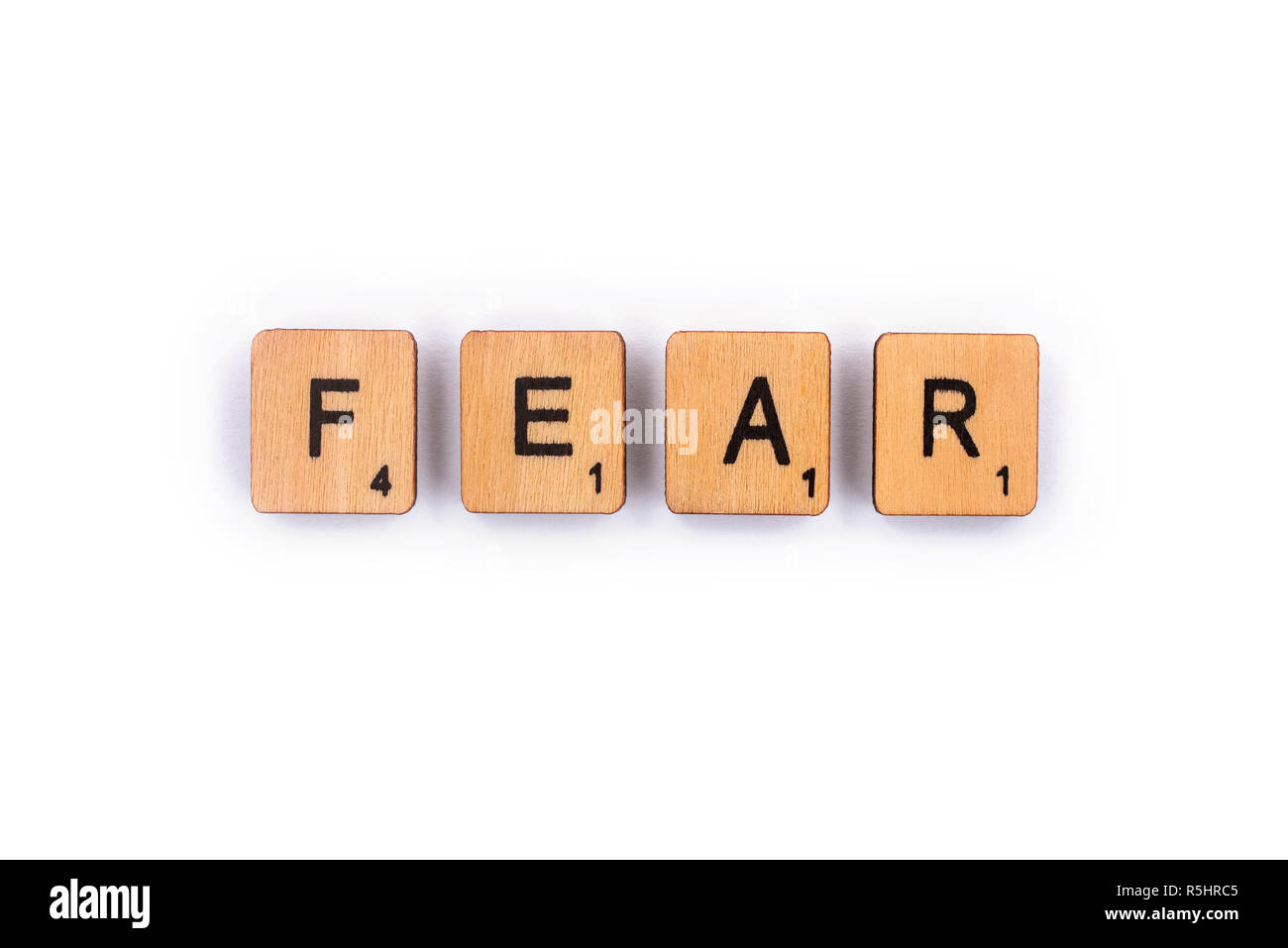 London, UK - July 8th 2018: FEAR, spelt with wooden letter tiles over a ...