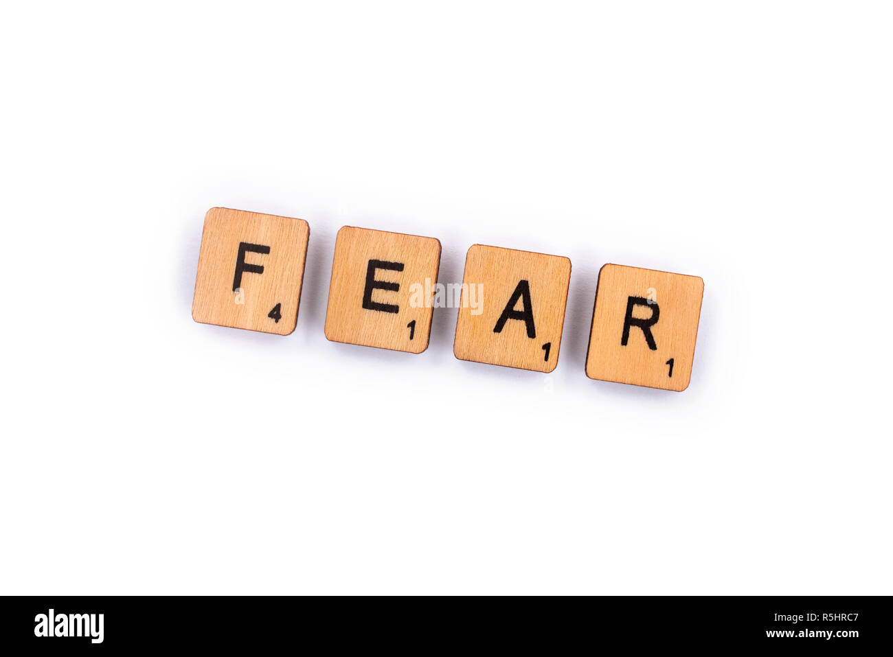 London, UK - July 8th 2018: FEAR, spelt with wooden letter tiles over a ...