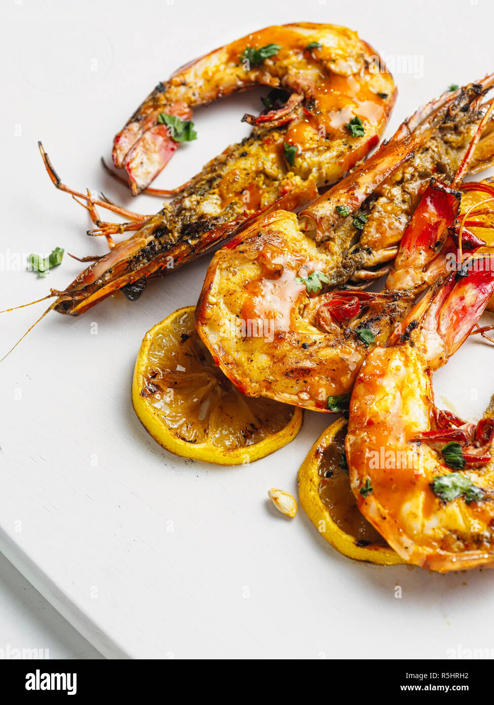 rustic piri-piri grilled prawn Stock Photo - Alamy