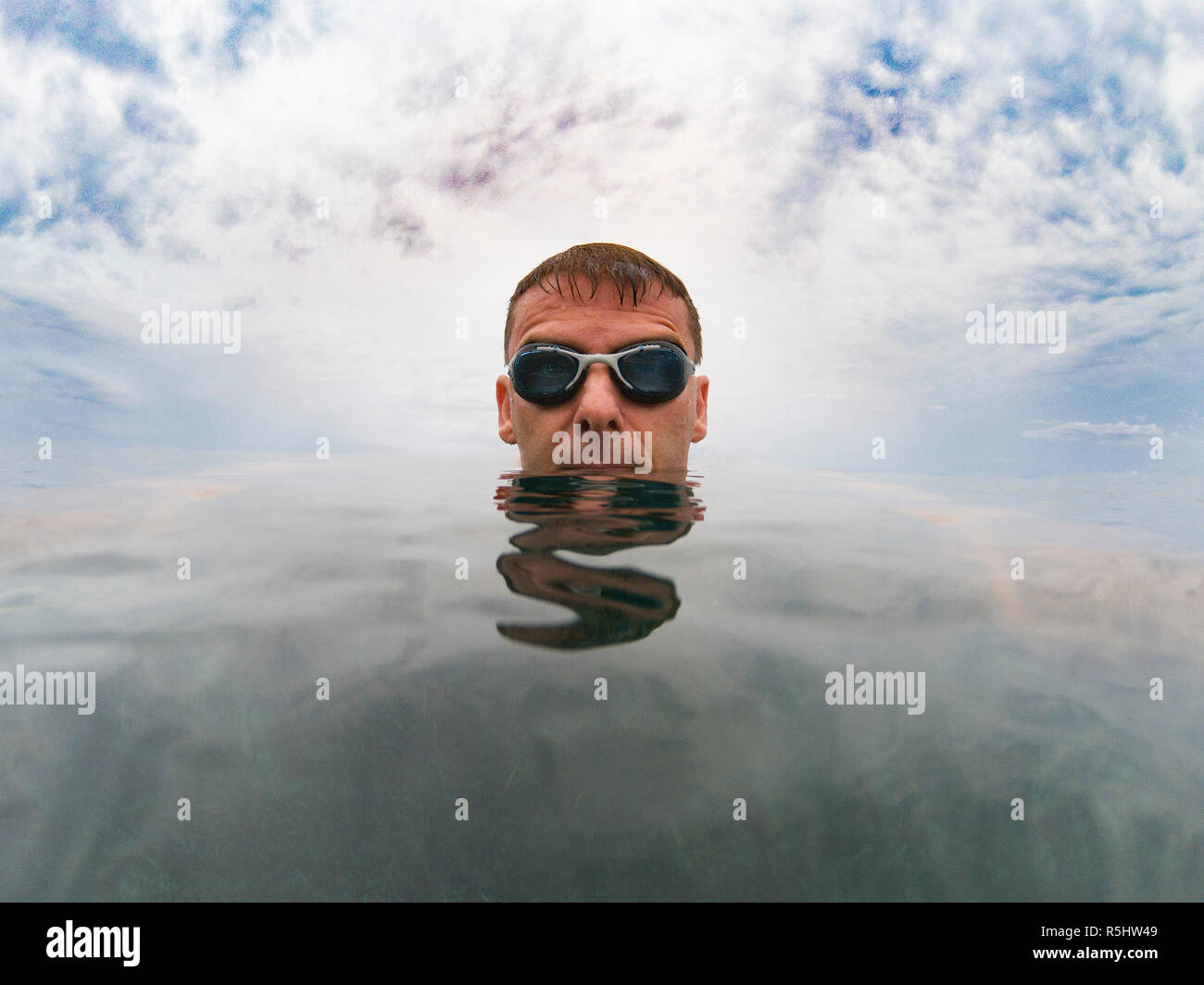 Man swims in sea glasses hi-res stock photography and images - Alamy