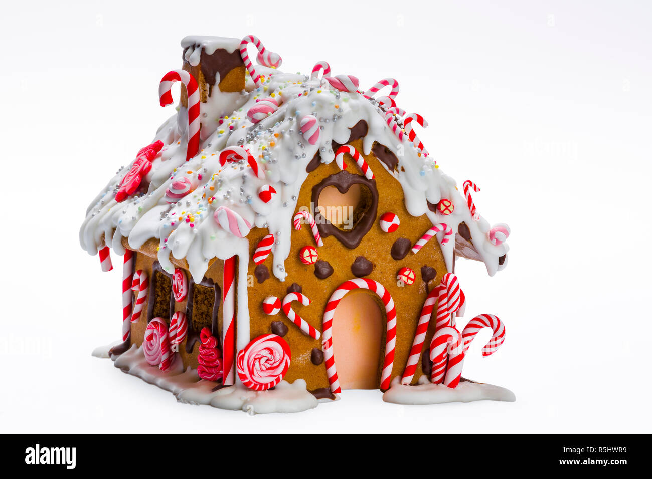gingerbread house with red candy canes white background Stock Photo - Alamy