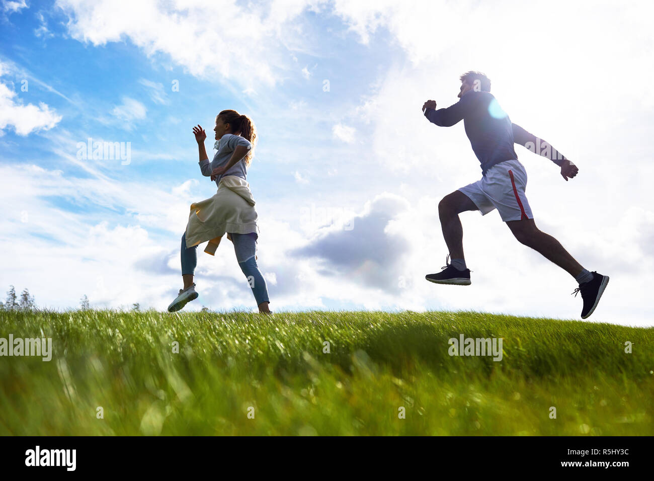 Man running grass hi-res stock photography and images - Alamy