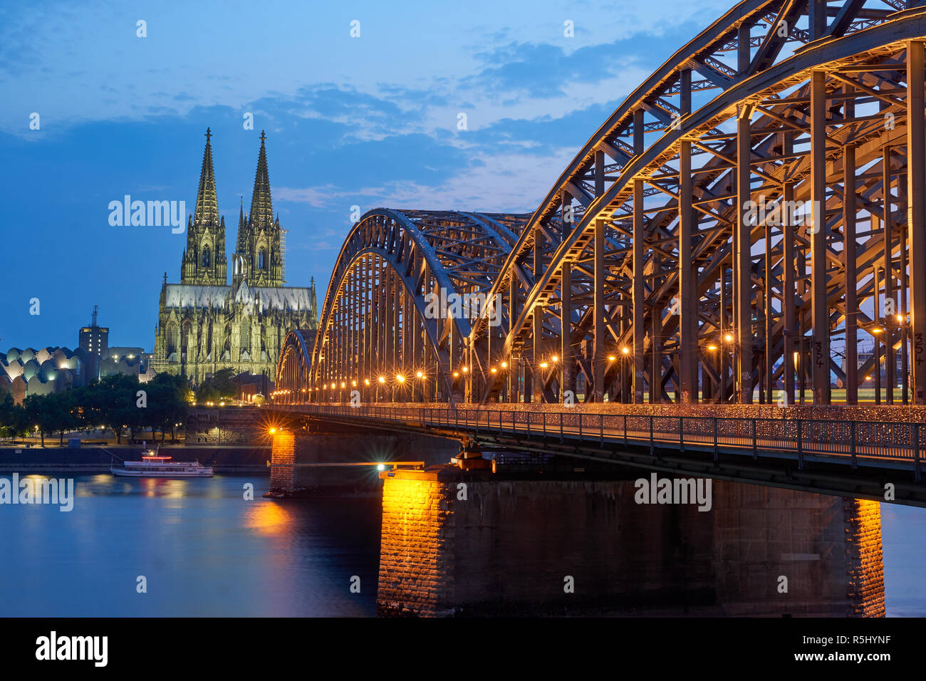 Cologne Cathedral and Hohenzollern Bridge at sunset, dusk Stock Photo ...