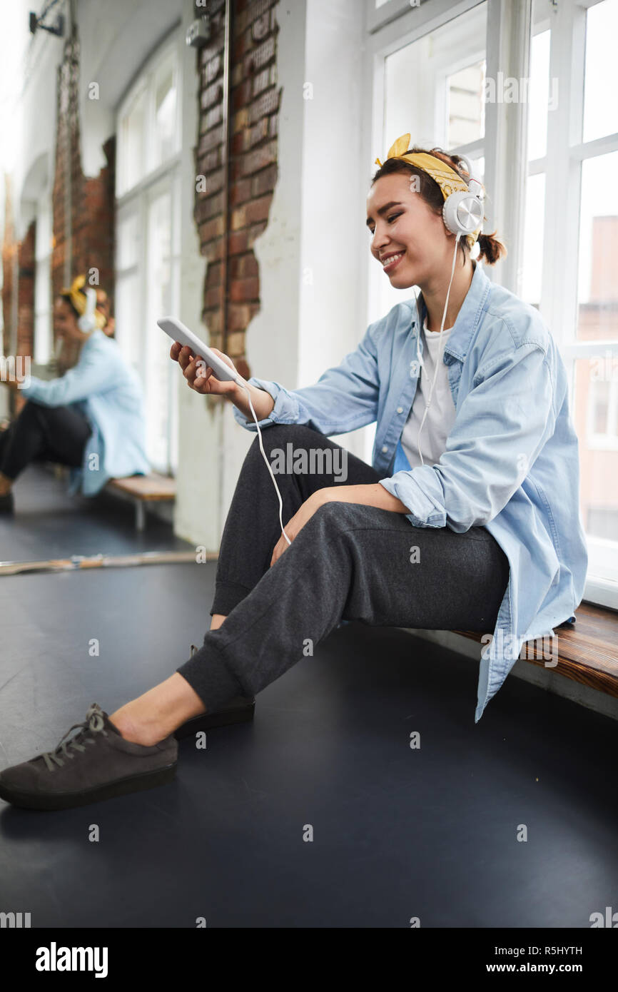 Woman listening music coach hi-res stock photography and images - Alamy