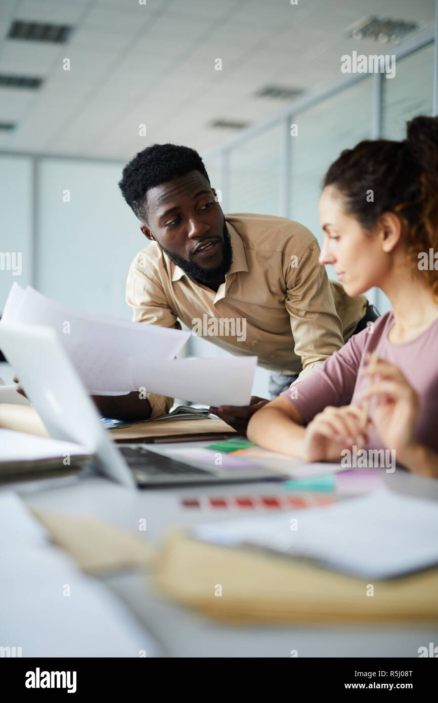 Looking through documents Stock Photo - Alamy