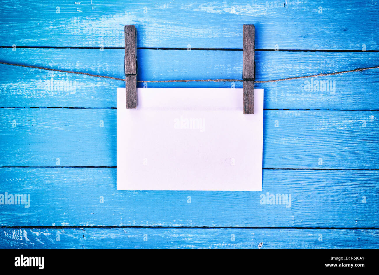 White paper envelope hanging on a rope Stock Photo - Alamy
