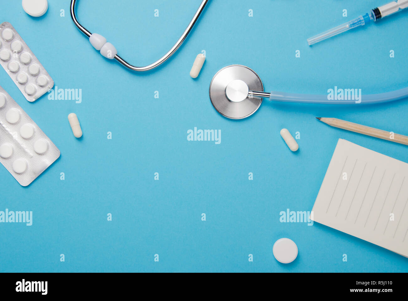 Medical concept blue background. Doctor's desk with instruments. Copy ...