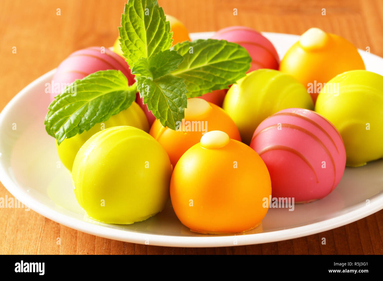 Fruit flavored pralines Stock Photo - Alamy