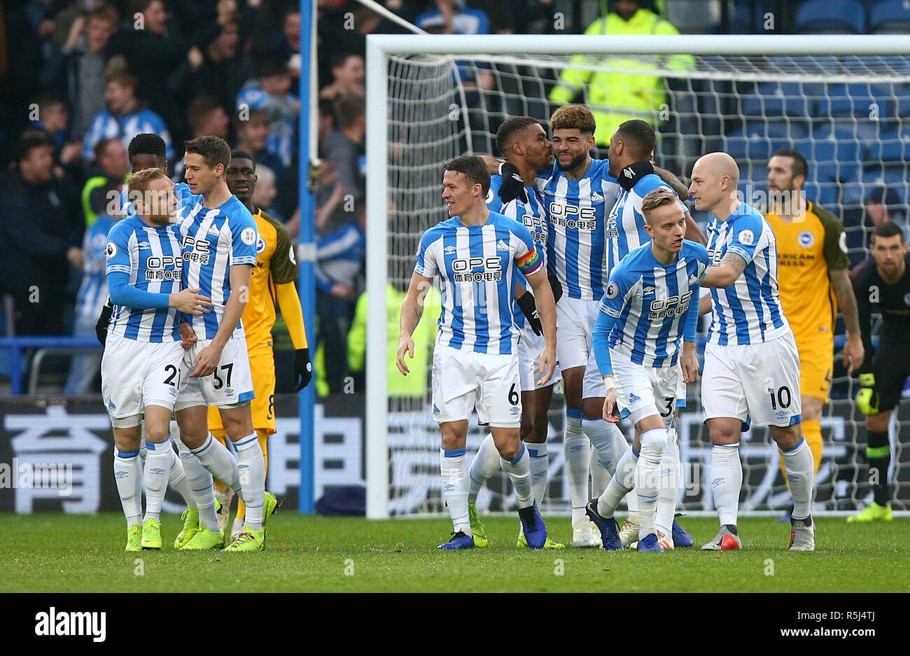 Huddersfield Town players celebrate their first goal scored by Mathias ...