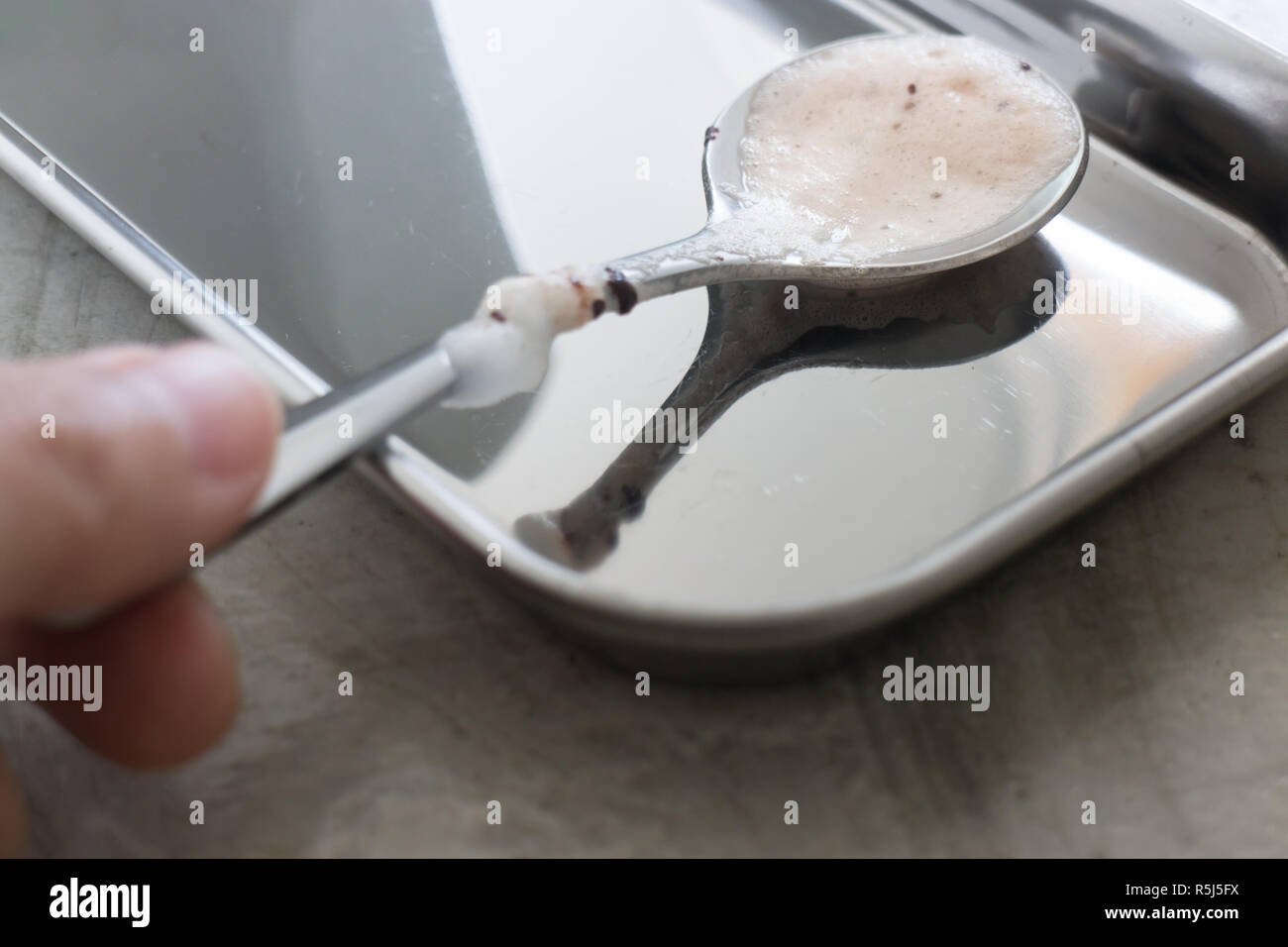 Shiny milk chocolate stain spoon Stock Photo - Alamy