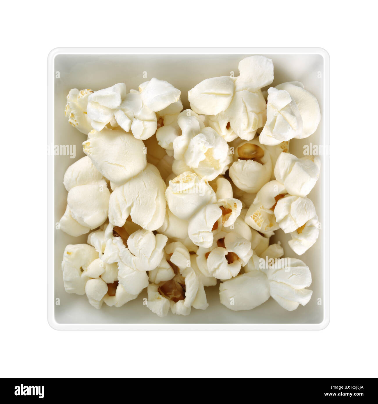 Popcorn in square bowl on white background Stock Photo - Alamy