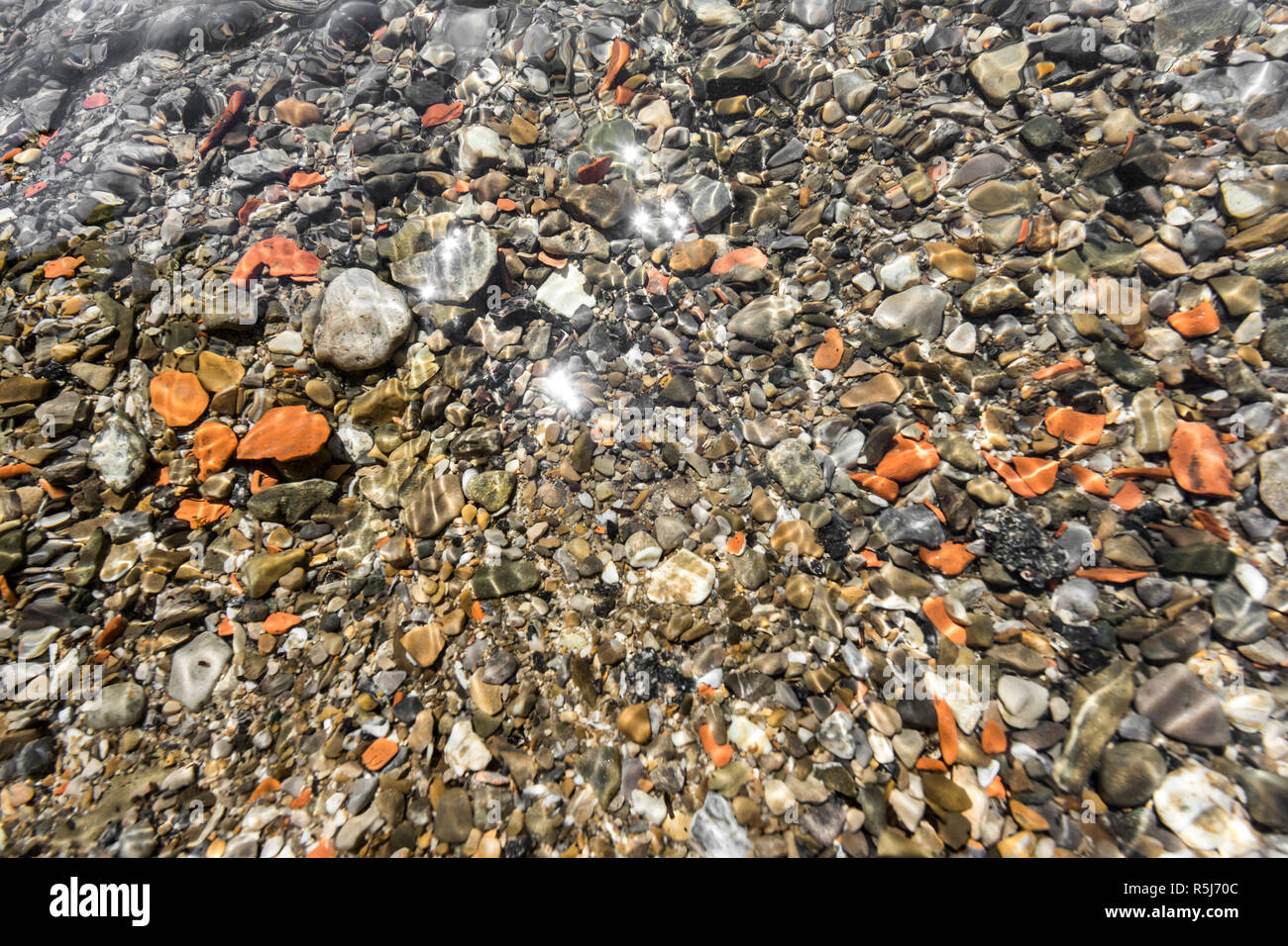 underwater pebbles lying in the sunshine Stock Photo - Alamy