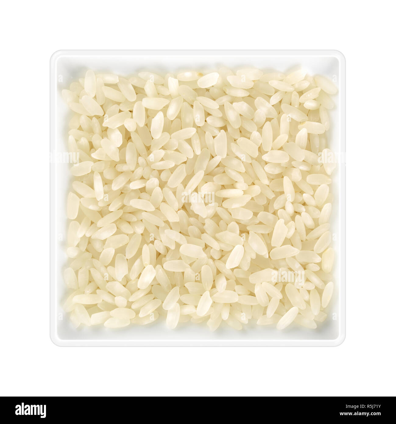 Stack white uncooked rice Cut Out Stock Images & Pictures - Alamy