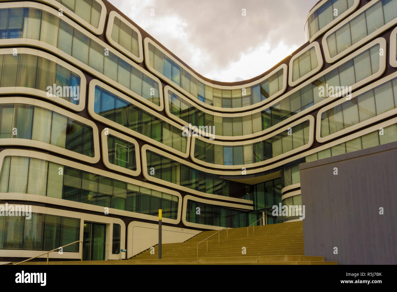a futuristic building with large windows Stock Photo - Alamy