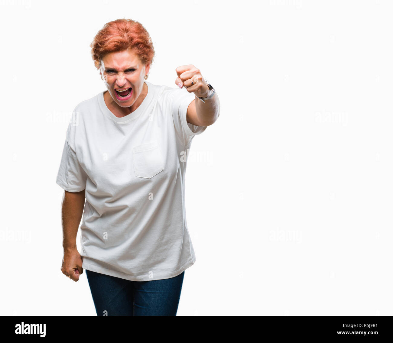 Atrractive senior caucasian redhead woman over isolated background ...