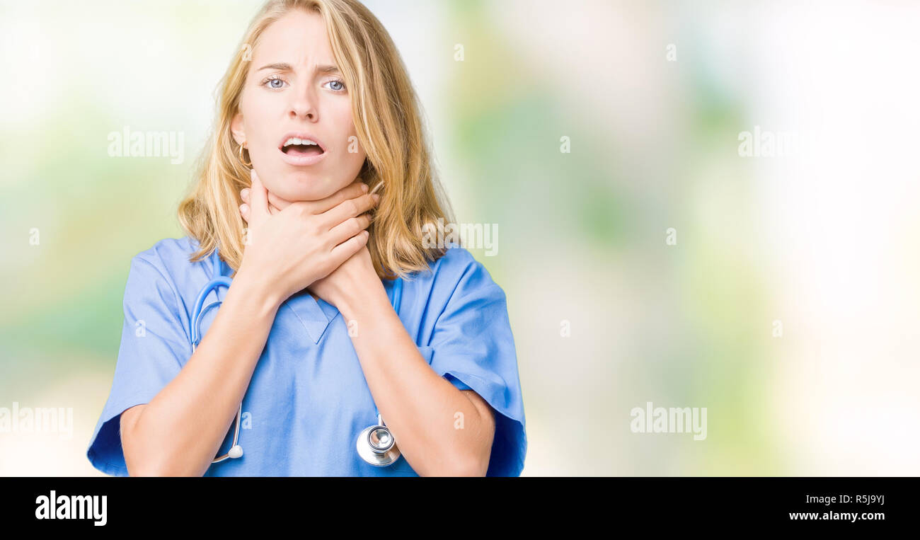 Beautiful young doctor woman wearing medical uniform over isolated ...