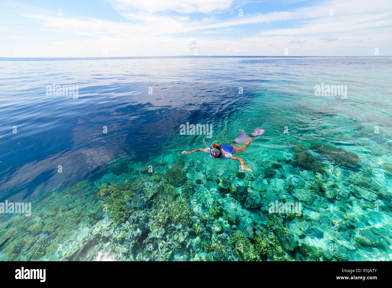 Woman snorkeling on coral reef tropical caribbean sea, turquoise blue ...