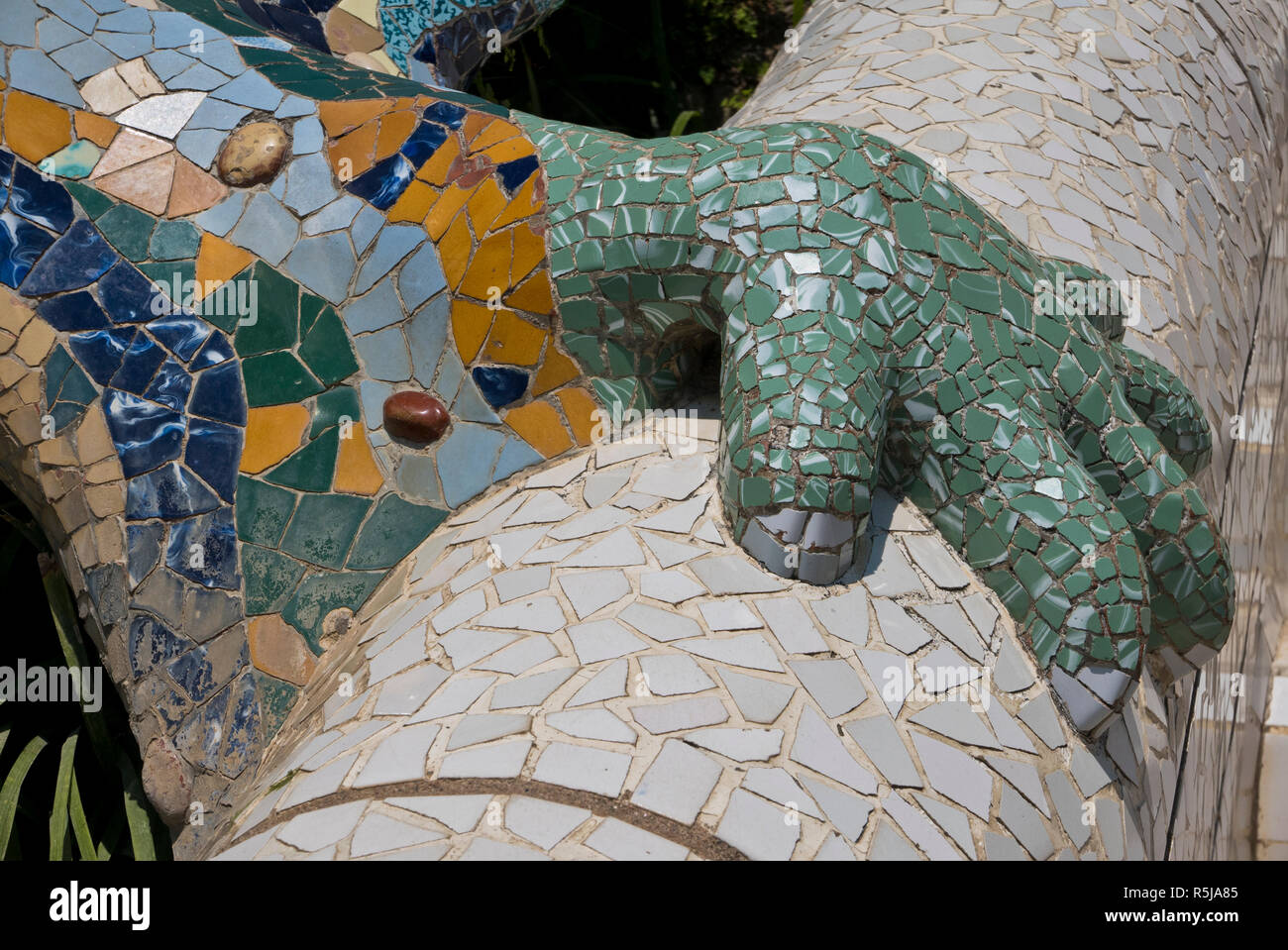 A decorative animal foot made of colourful mosaic in the Park Guell ...