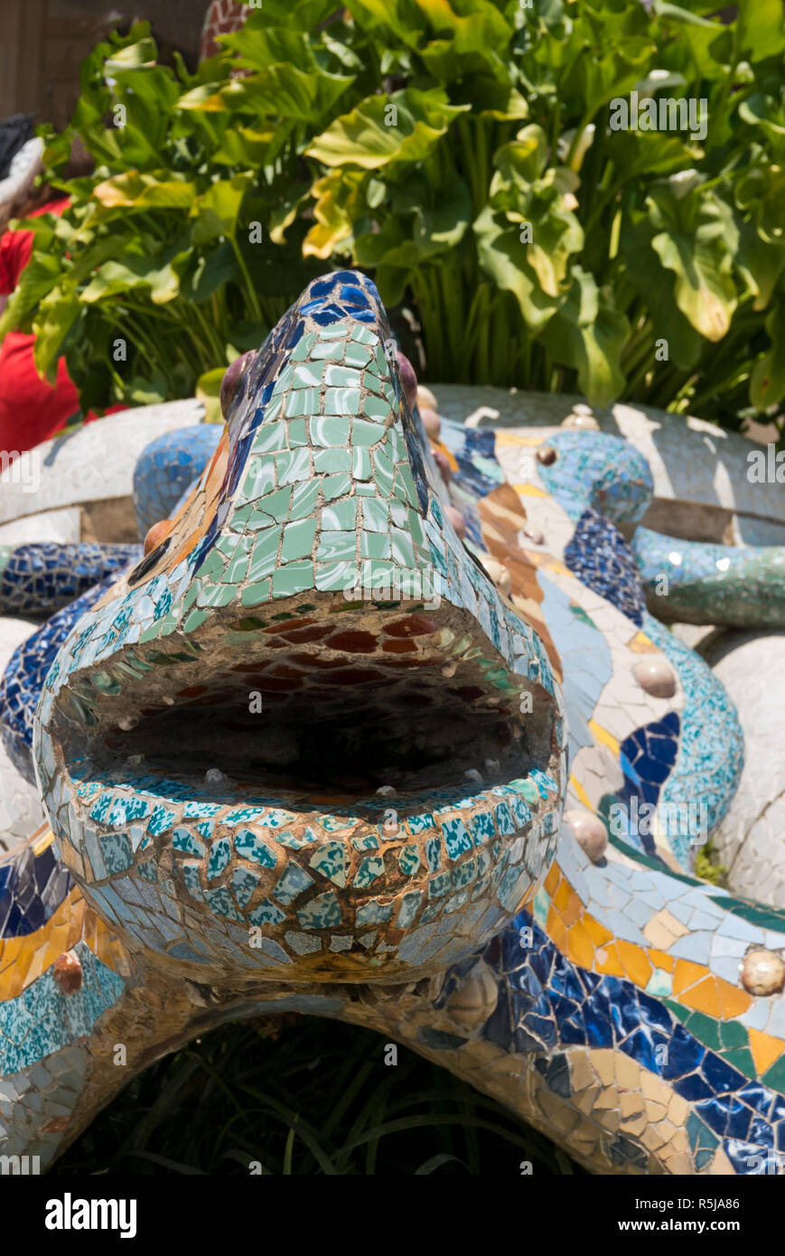 A decorative animal head made of colourful mosaic in the Park Guell ...