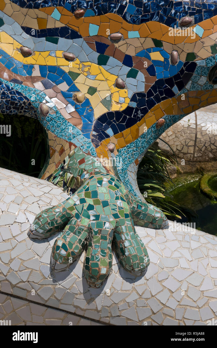 A decorative animal foot made of colourful mosaic in the Park Guell ...