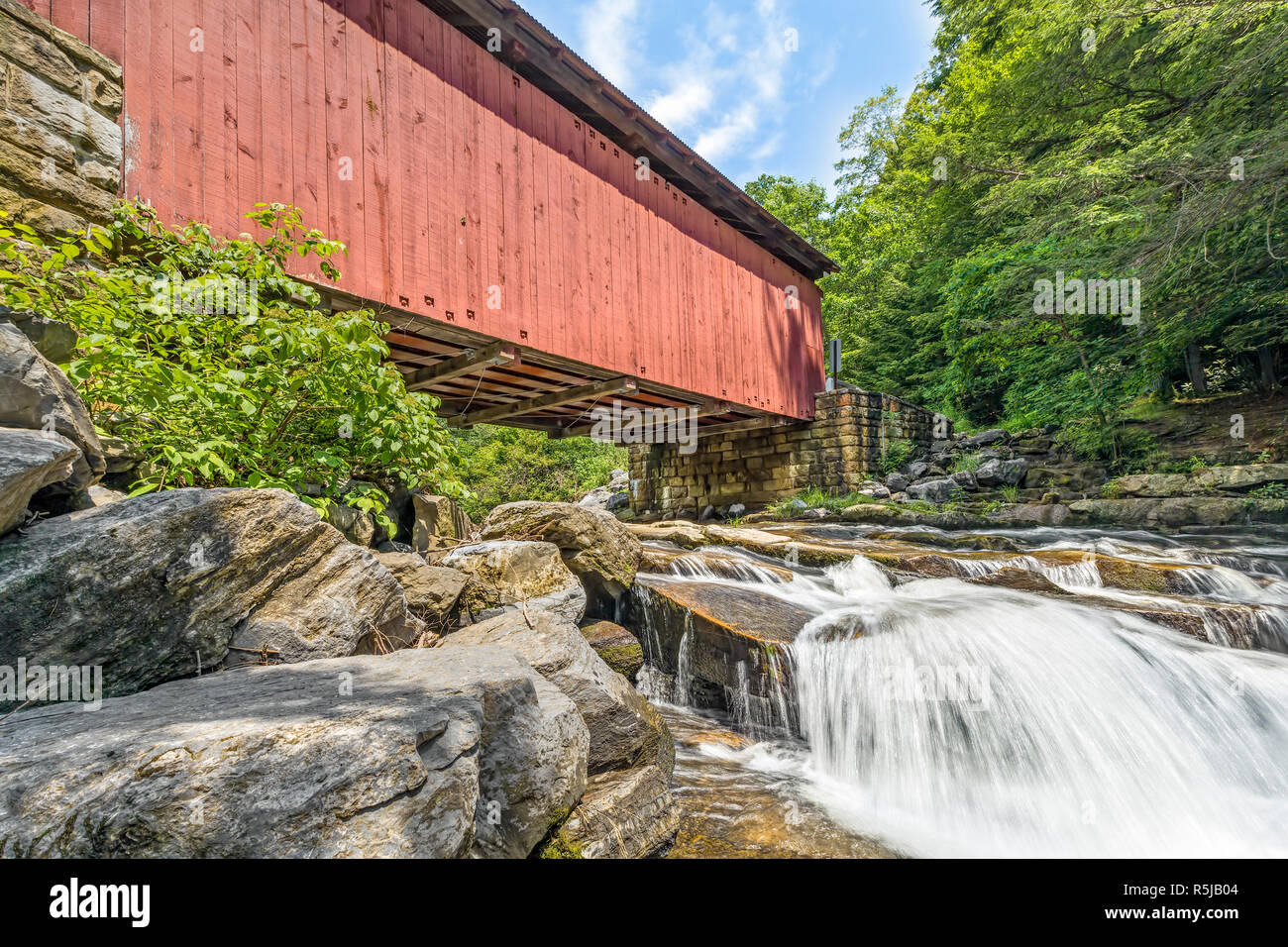 Built in 1887, the historic Packsaddle Covered Bridge crosses over a ...